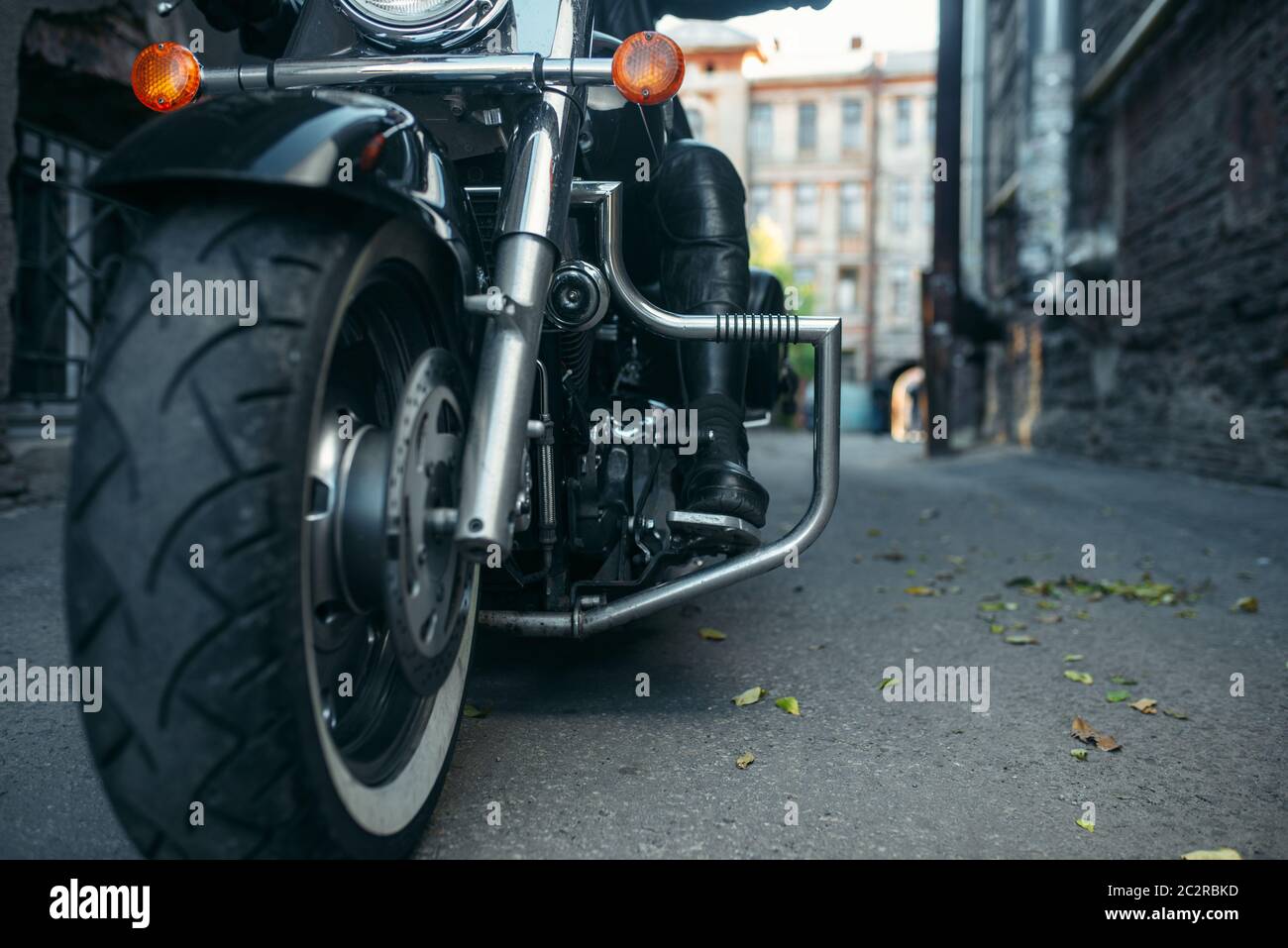 Bearded motorcyclist poses on classical chopper, biker. Vintage bike ...