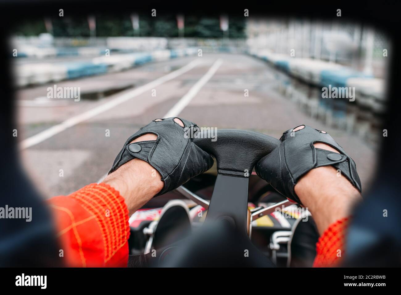 Karting driver on start line, view through the eyes of the racer. Go ...