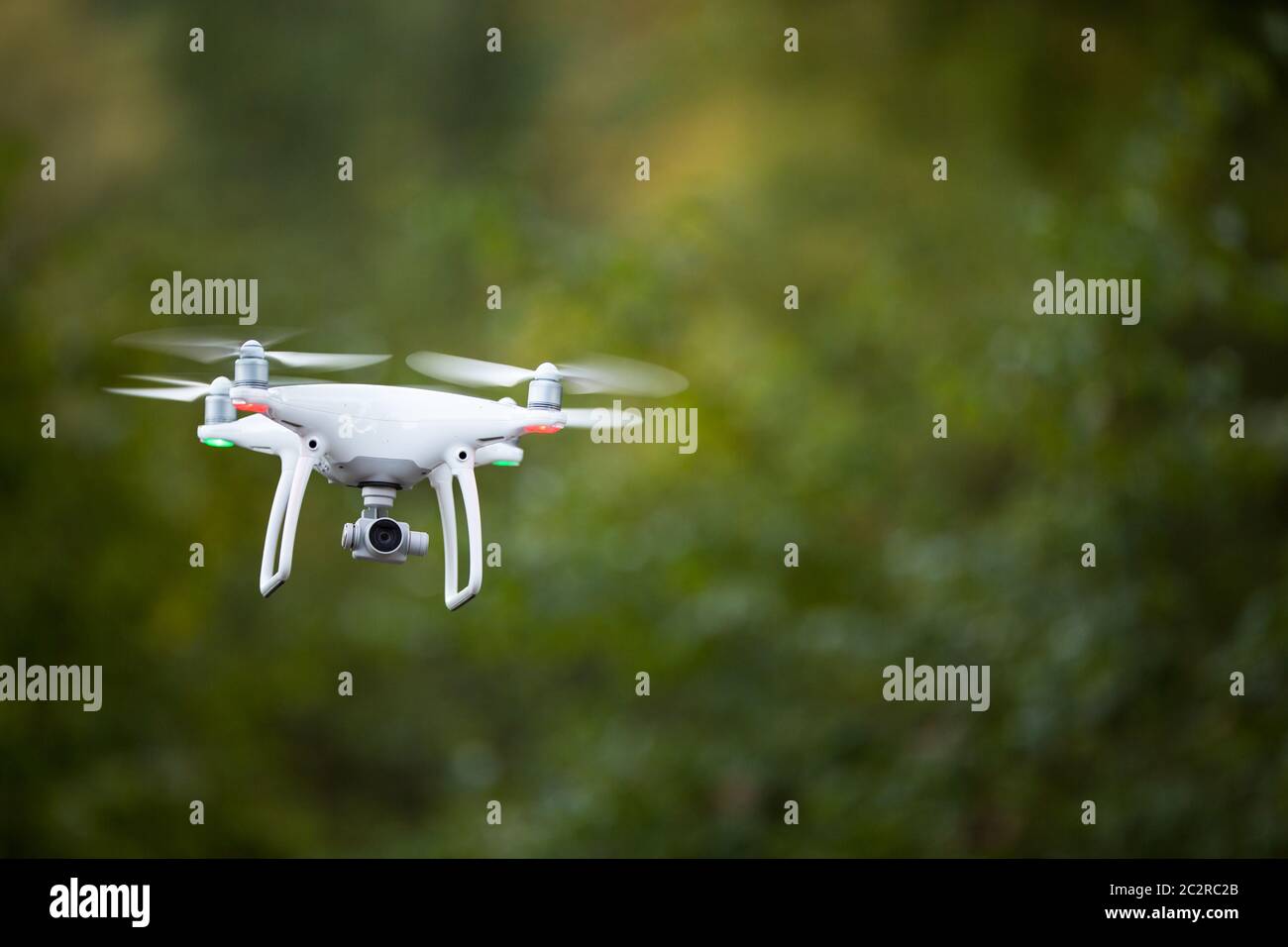 Quadrocopter drone with the camera in flight Stock Photo - Alamy