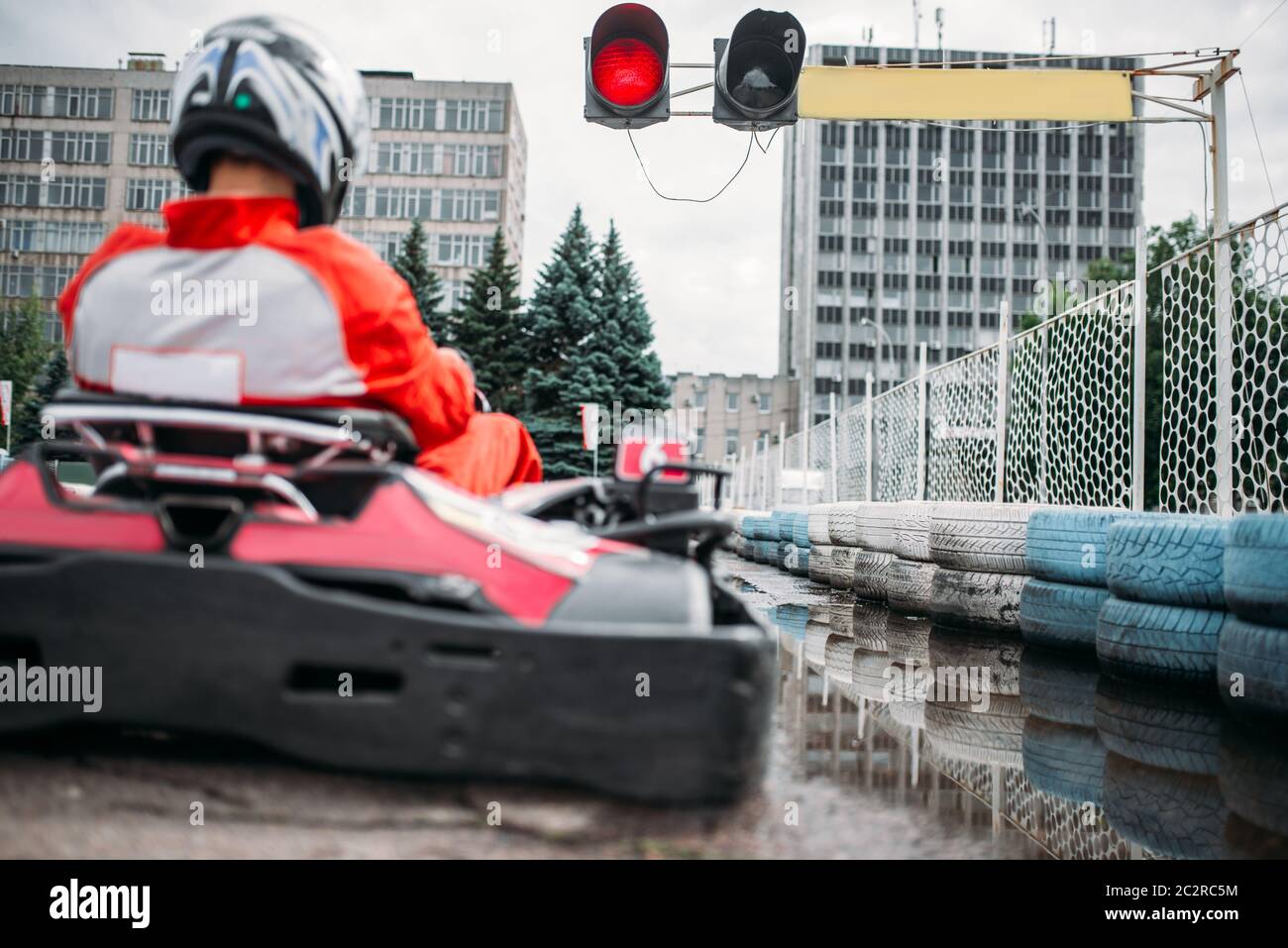 Karting racer, go kart driver on start line, back view. Carting speed ...