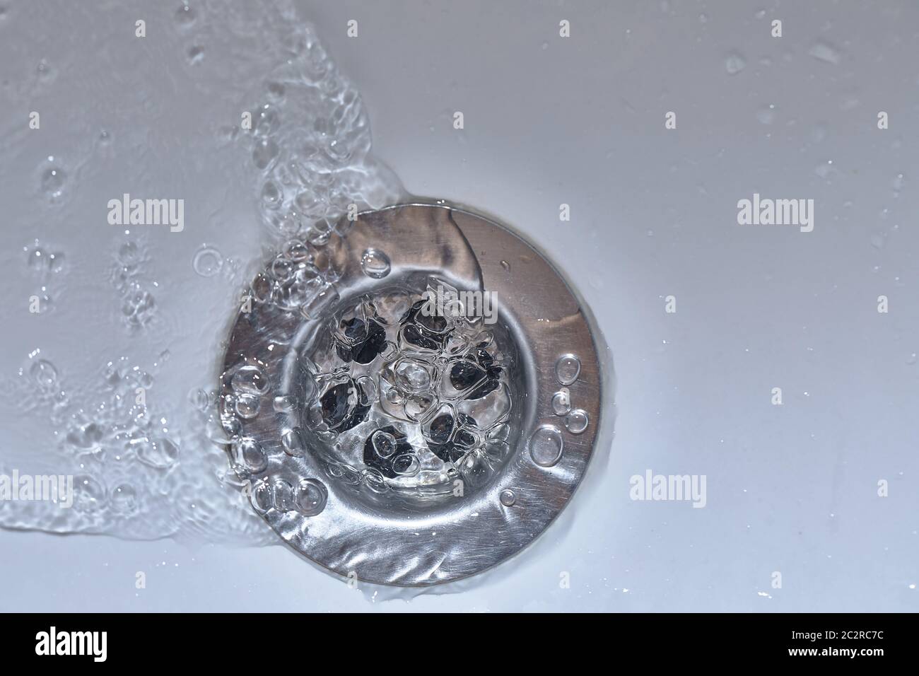 Water flowing down the drain Stock Photo - Alamy