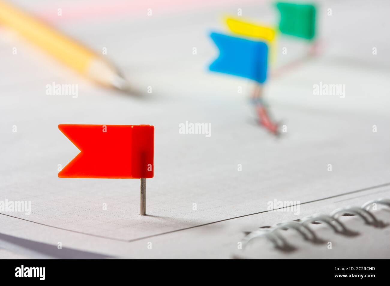 Red pin standing out of sketched diagram Stock Photo - Alamy