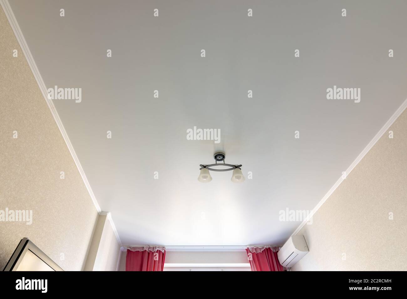 Stretch white matte ceiling in the room Stock Photo - Alamy