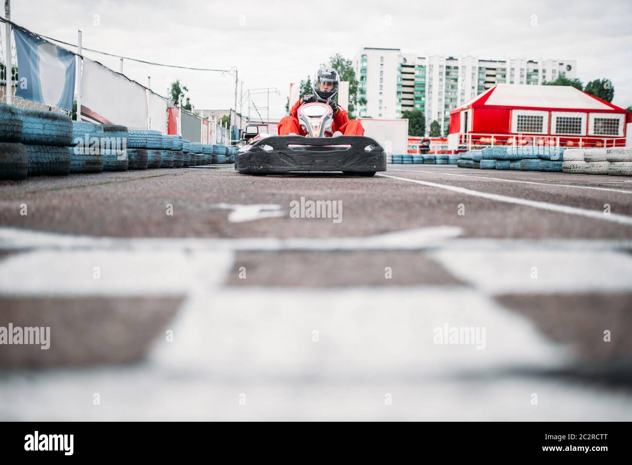 Karting racer on finish line, go kart competition. Carting championship ...