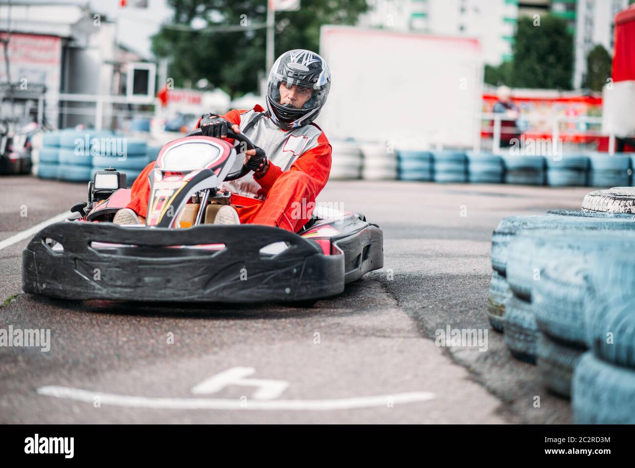 Karting racer in action, go kart competition on outdoor track. Carting ...