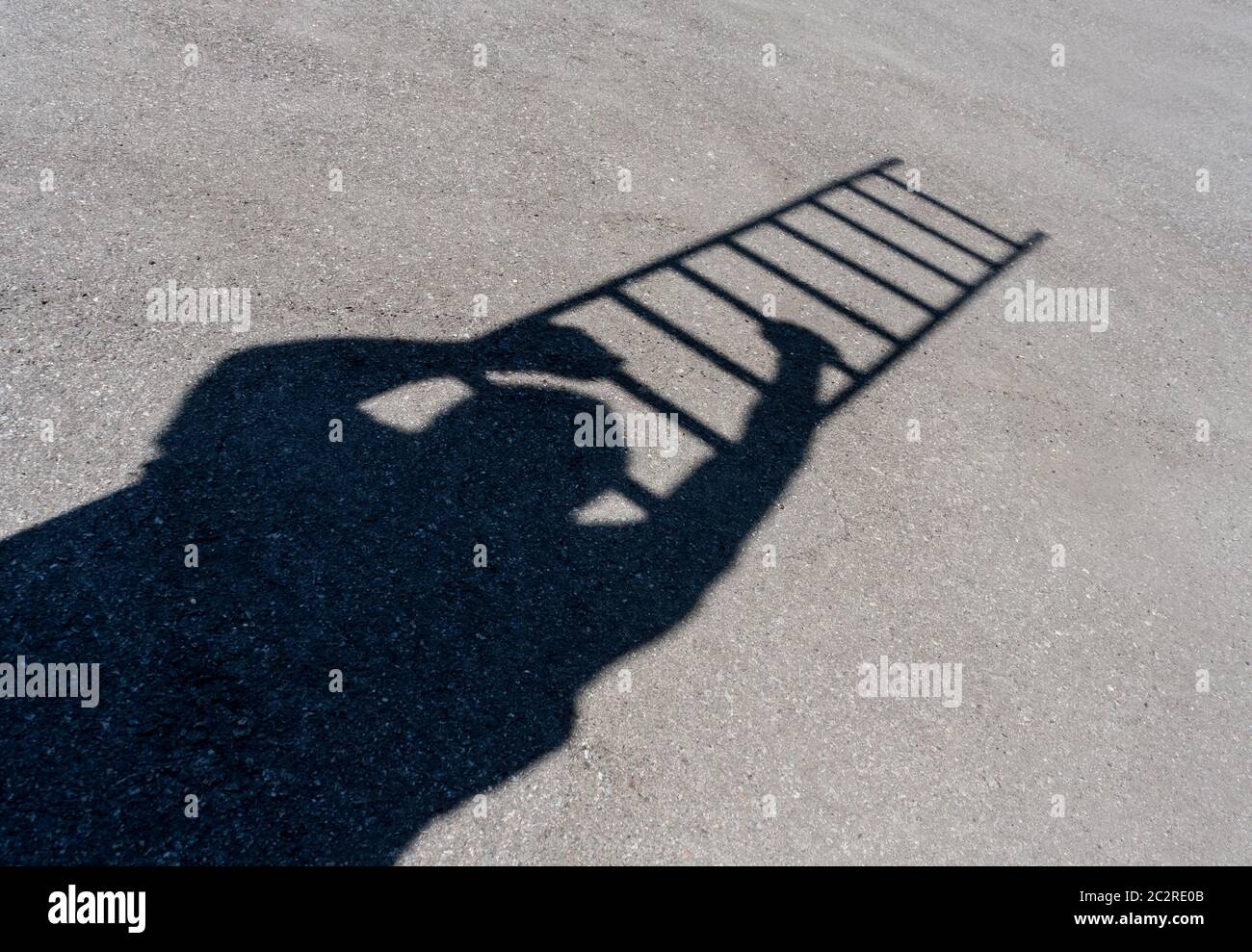 Shadow of man climbing ladder on asphalt Stock Photo - Alamy