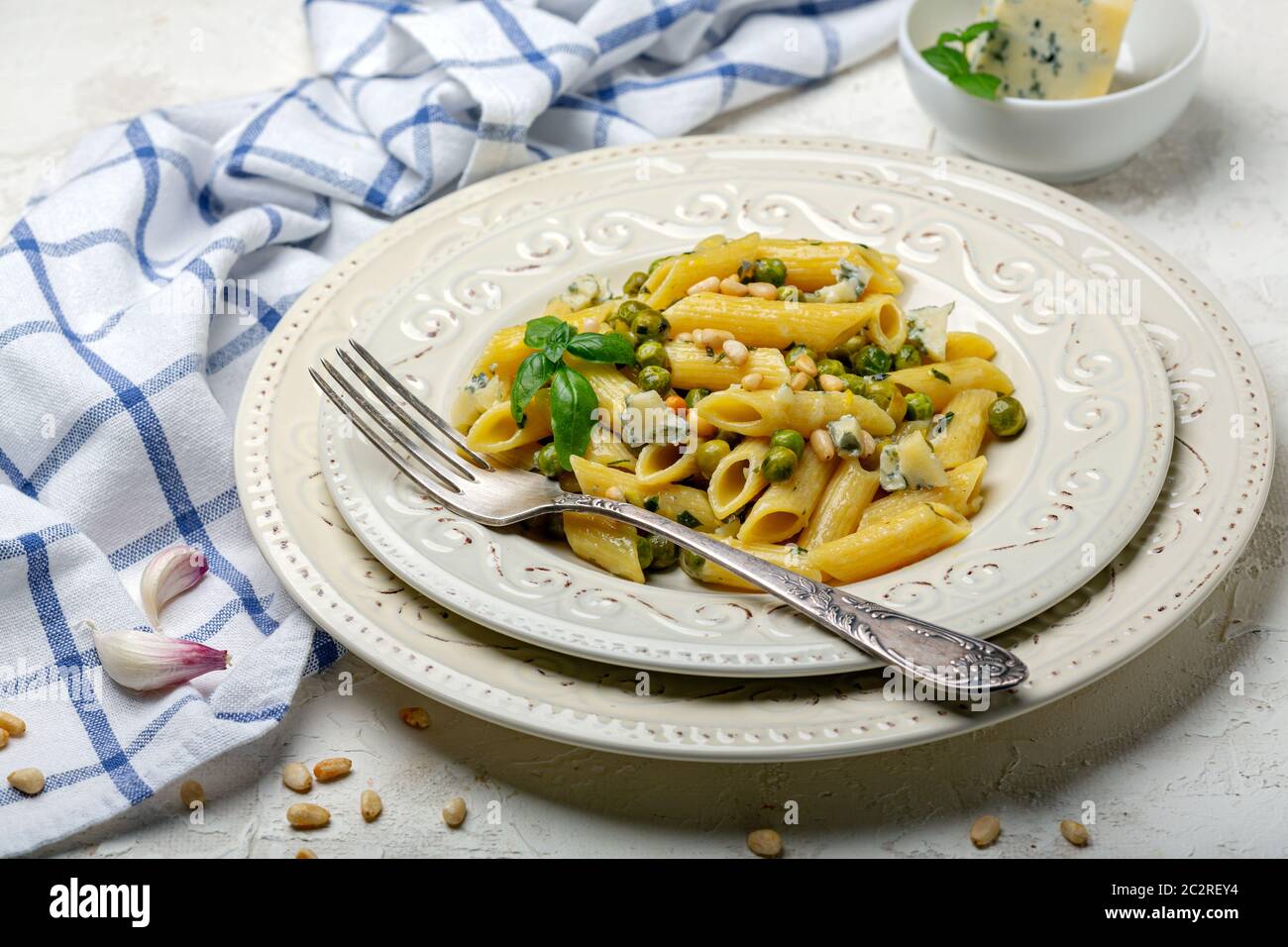 Delicious pasta with green peas and blue cheese Stock Photo - Alamy