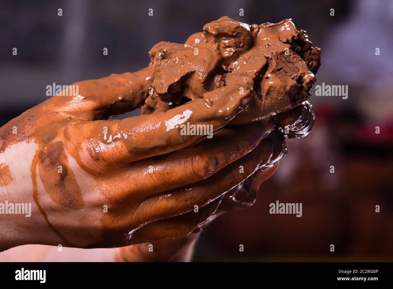 raw clay in the hands of women Stock Photo - Alamy