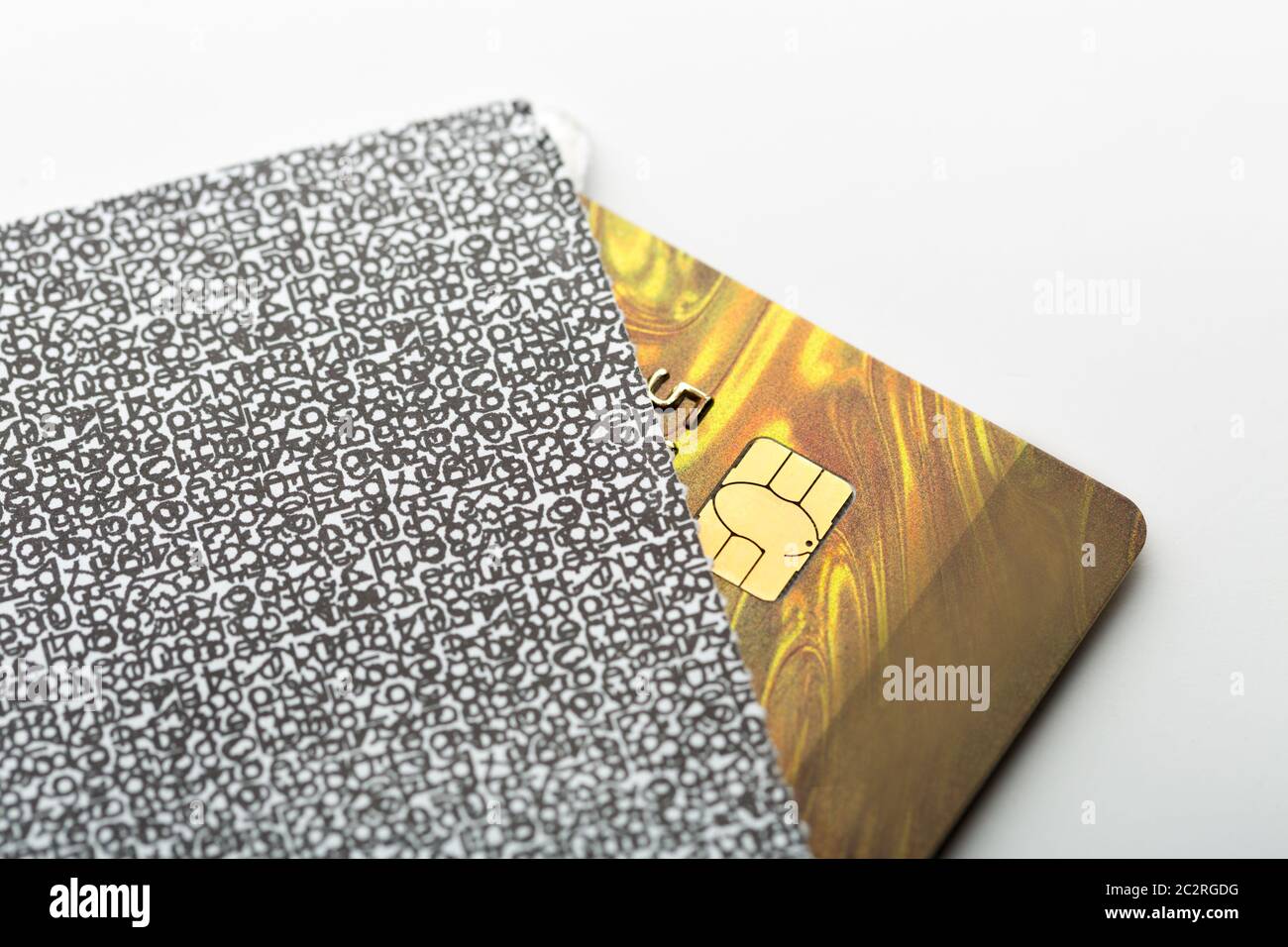 Gold credit card in the envelope on a white table Stock Photo - Alamy