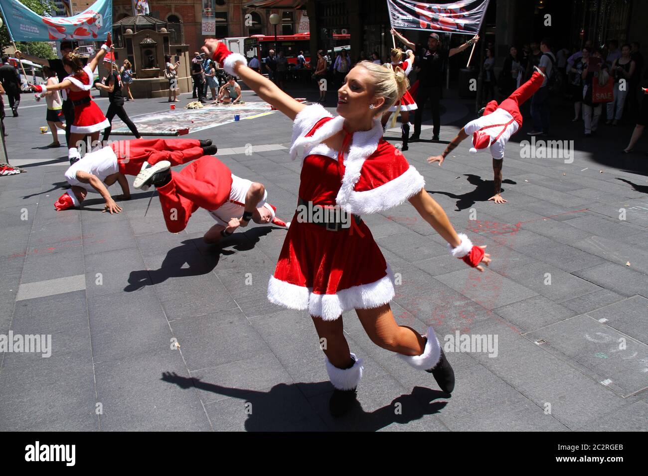 The Santa Fest flash mob performs in front of the Queen Victoria ...