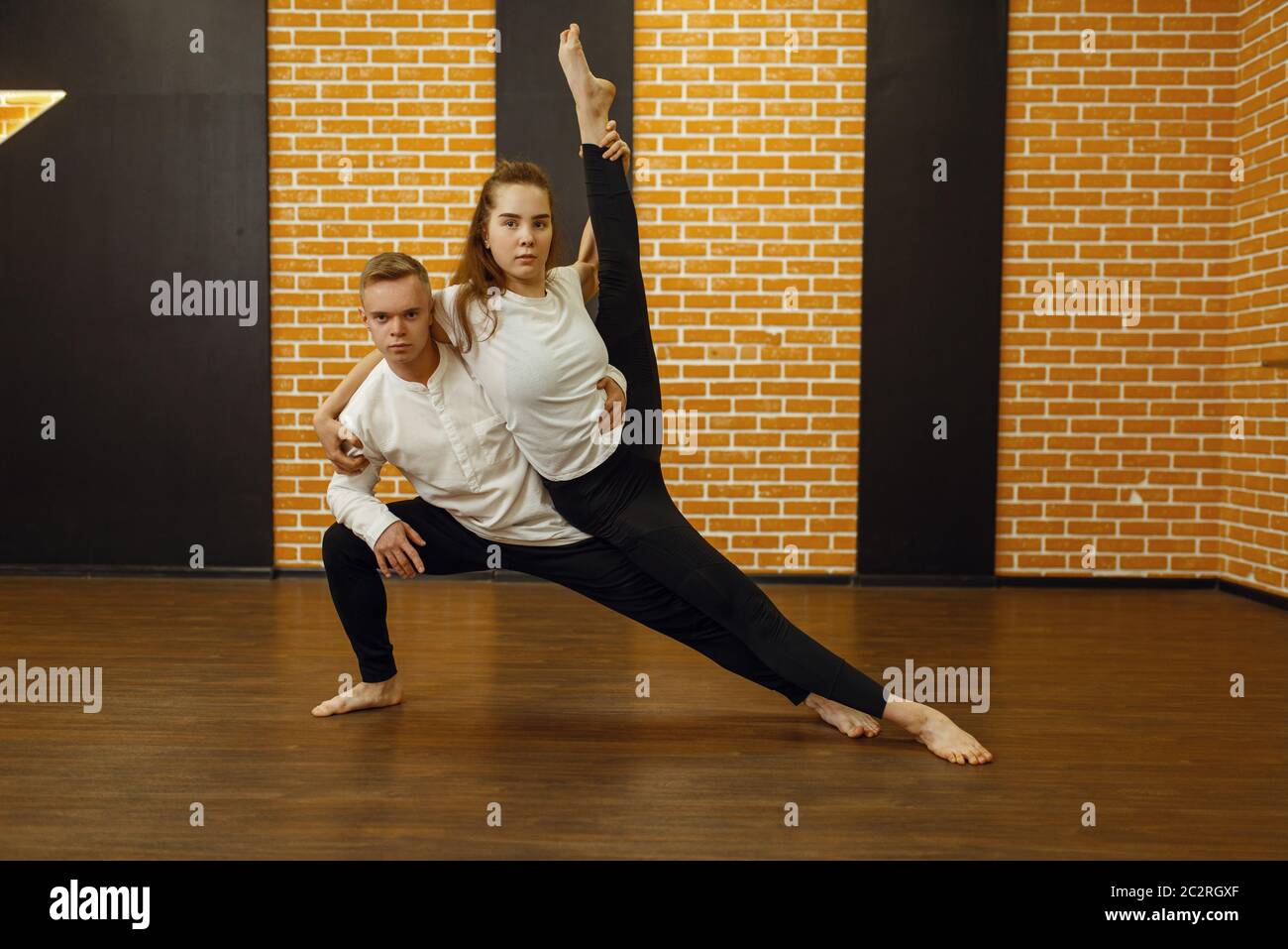 Contemporary dance performers, couple posing in studio. Male and female ...
