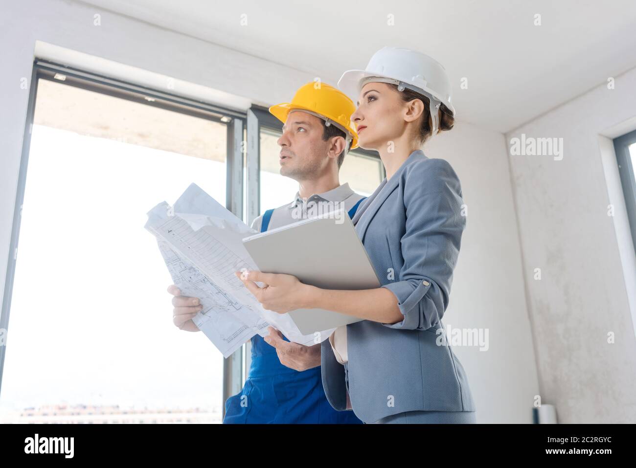 Project owner and construction worker during acceptance checking ...