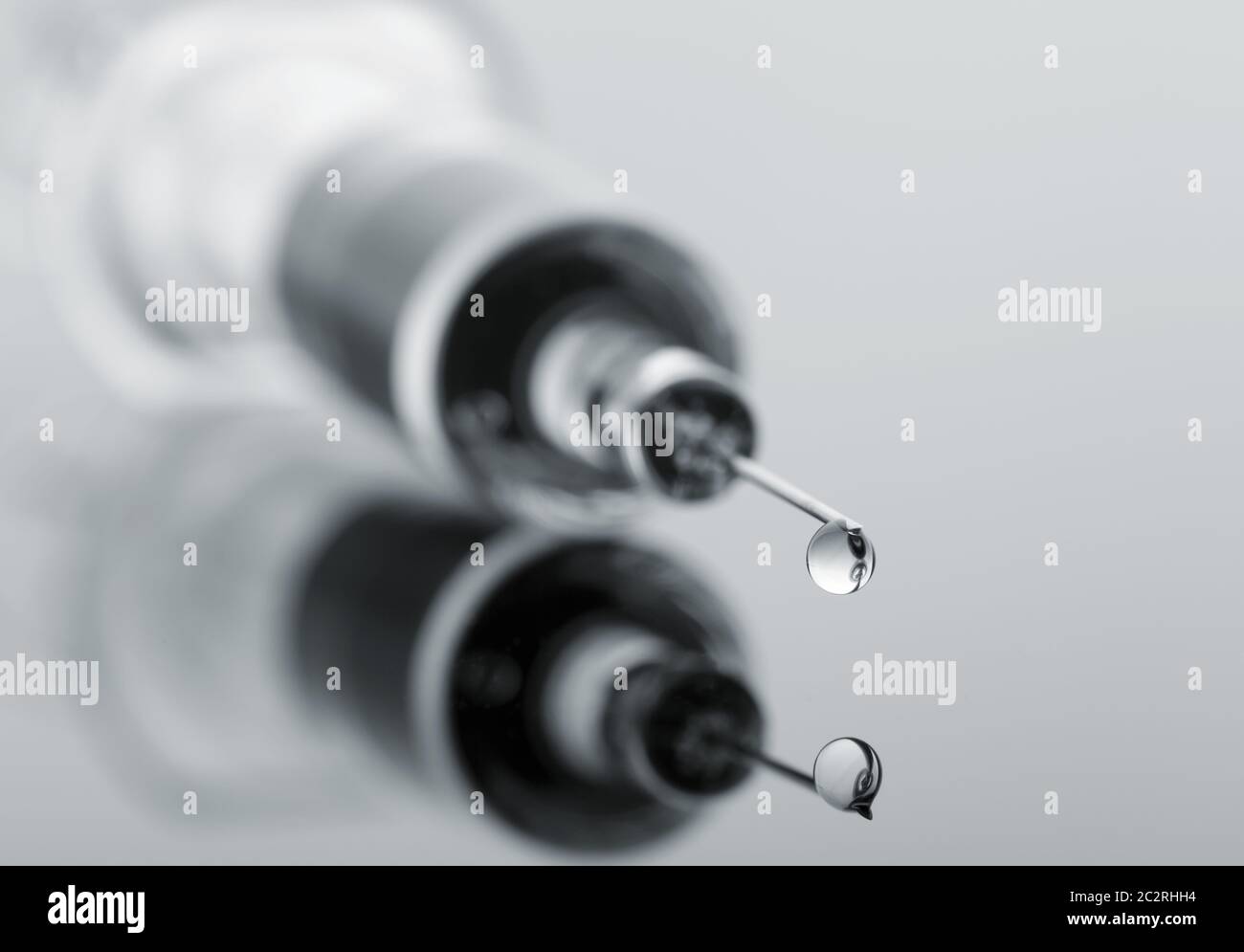 Medical syringe with injection solution drop closeup picture Stock ...