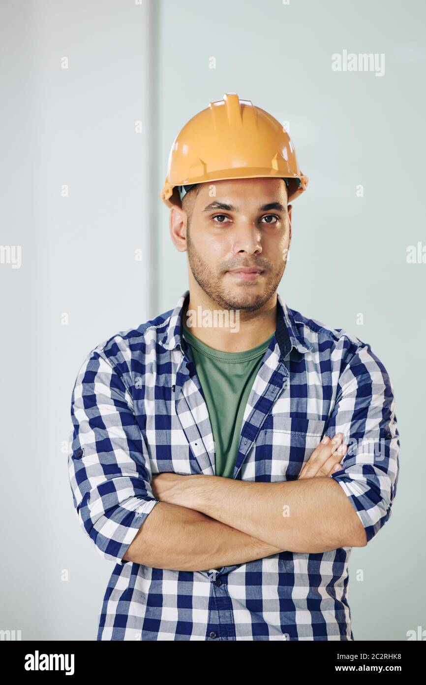 Waist up portrait shot of modern construction worker wearing checked ...