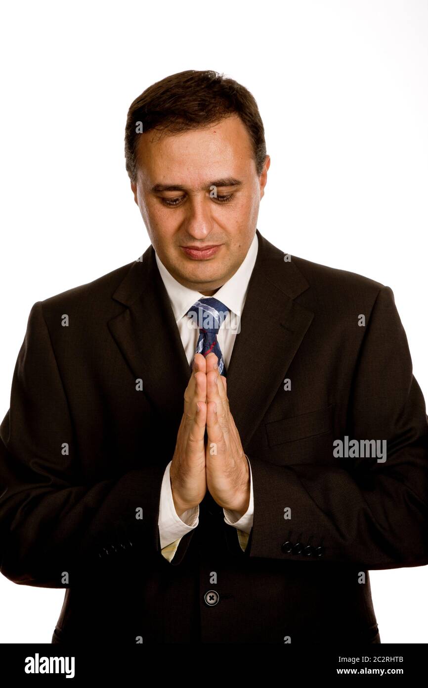 business man praying, isolated on white background Stock Photo - Alamy
