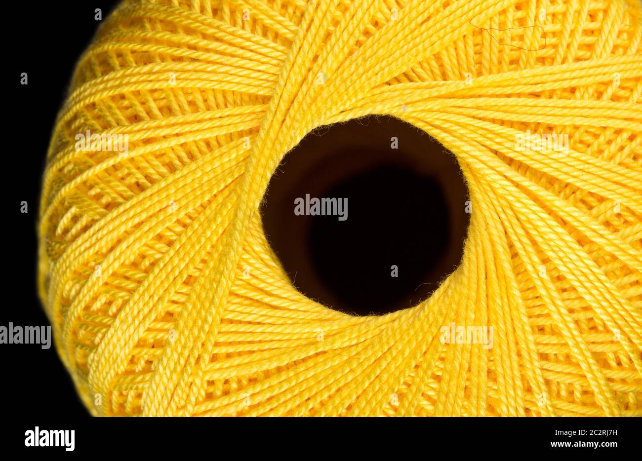 Yellow tangle of thread for knitting. Top view Stock Photo - Alamy