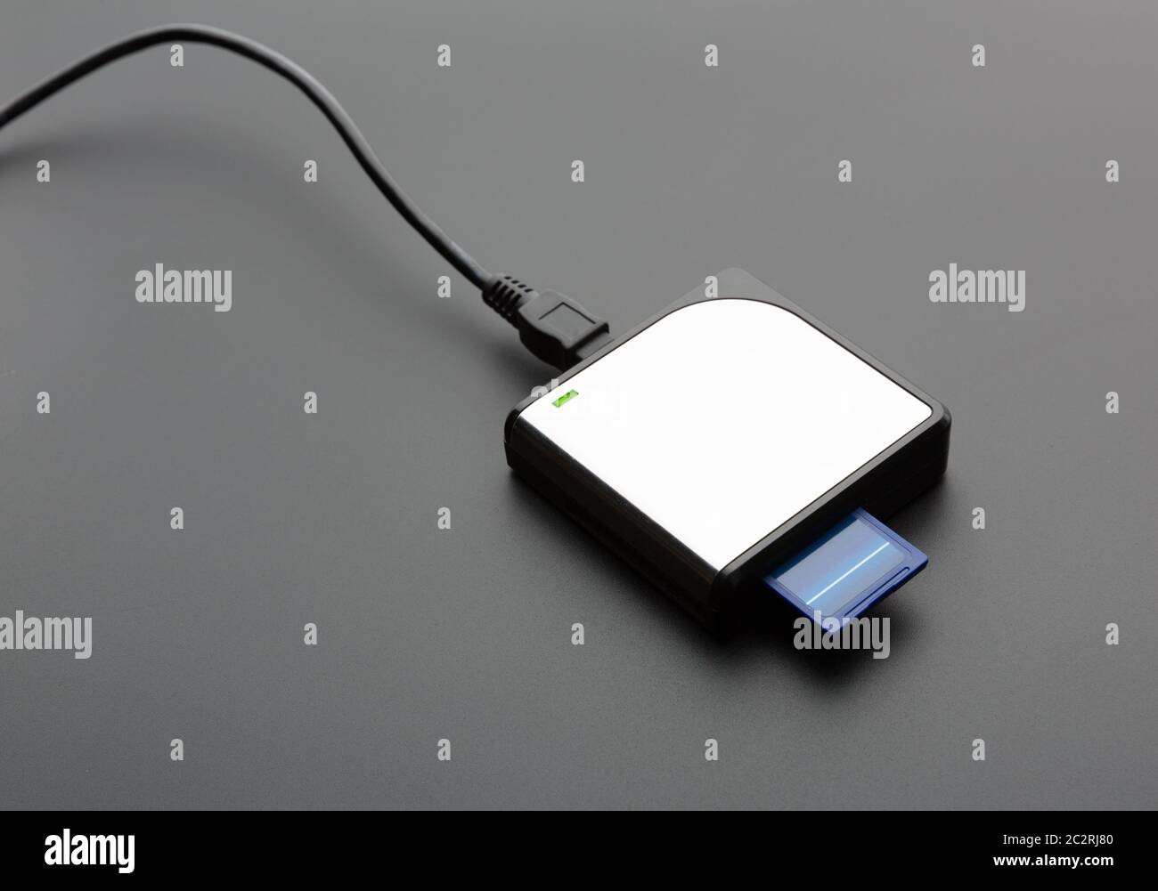 Reader for standard SD memory cards on grey Stock Photo - Alamy