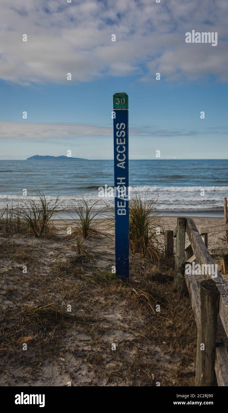 Beach access sign looking at waves on a beautiful summer beach Stock ...