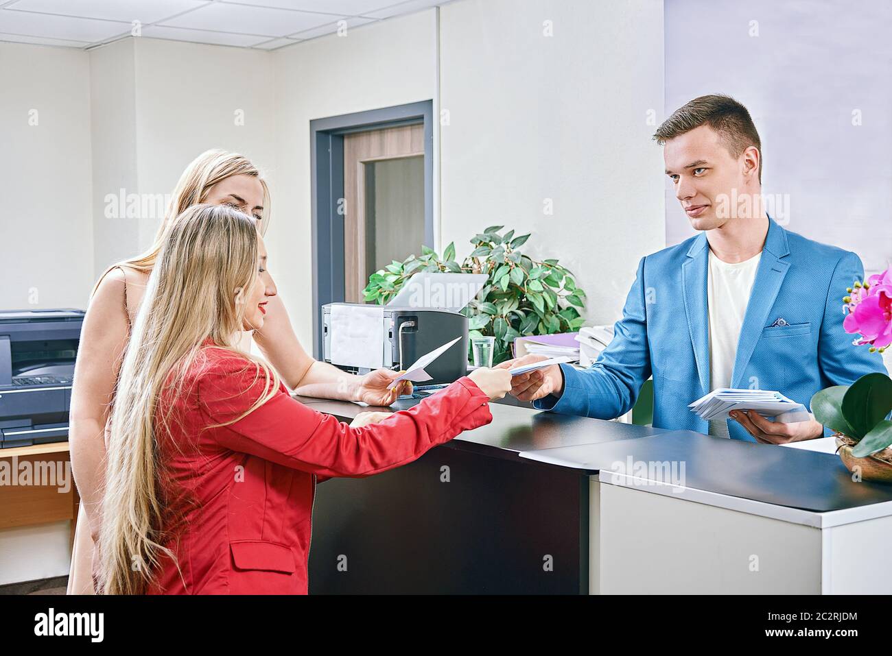 office staff at the reception. male secretary manager Stock Photo - Alamy