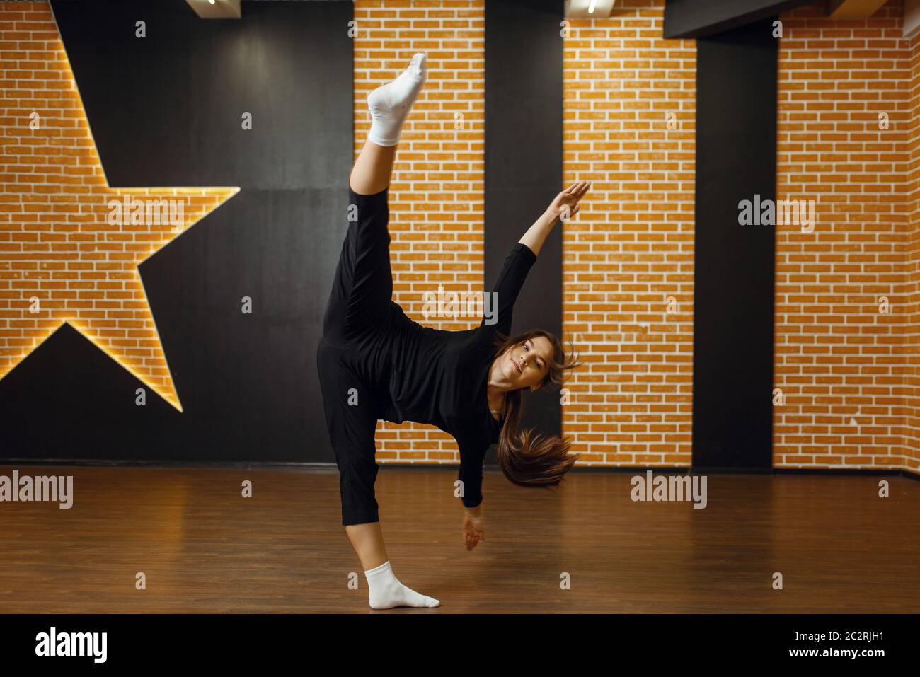 Contemporary dance performer, woman in studio, body flexibility. Dancer ...