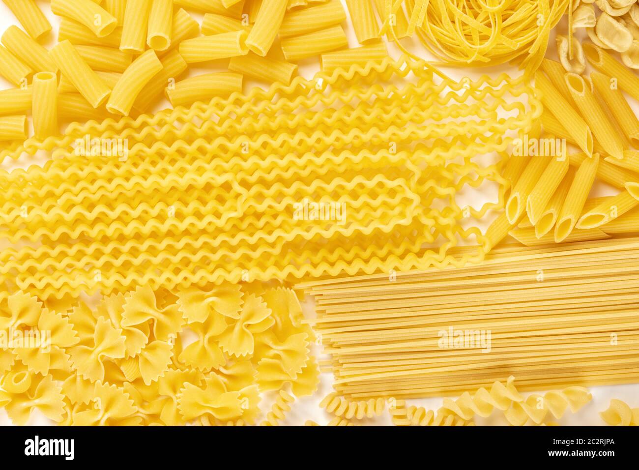 Italian pasta texture, flatlay overhead shot on a white background ...