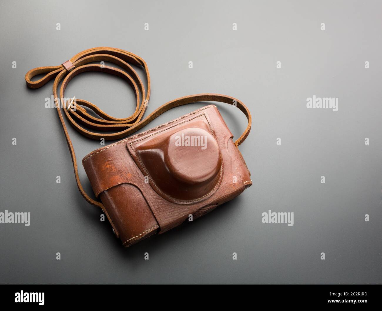 Vintage old film camera in leather brown case Stock Photo - Alamy