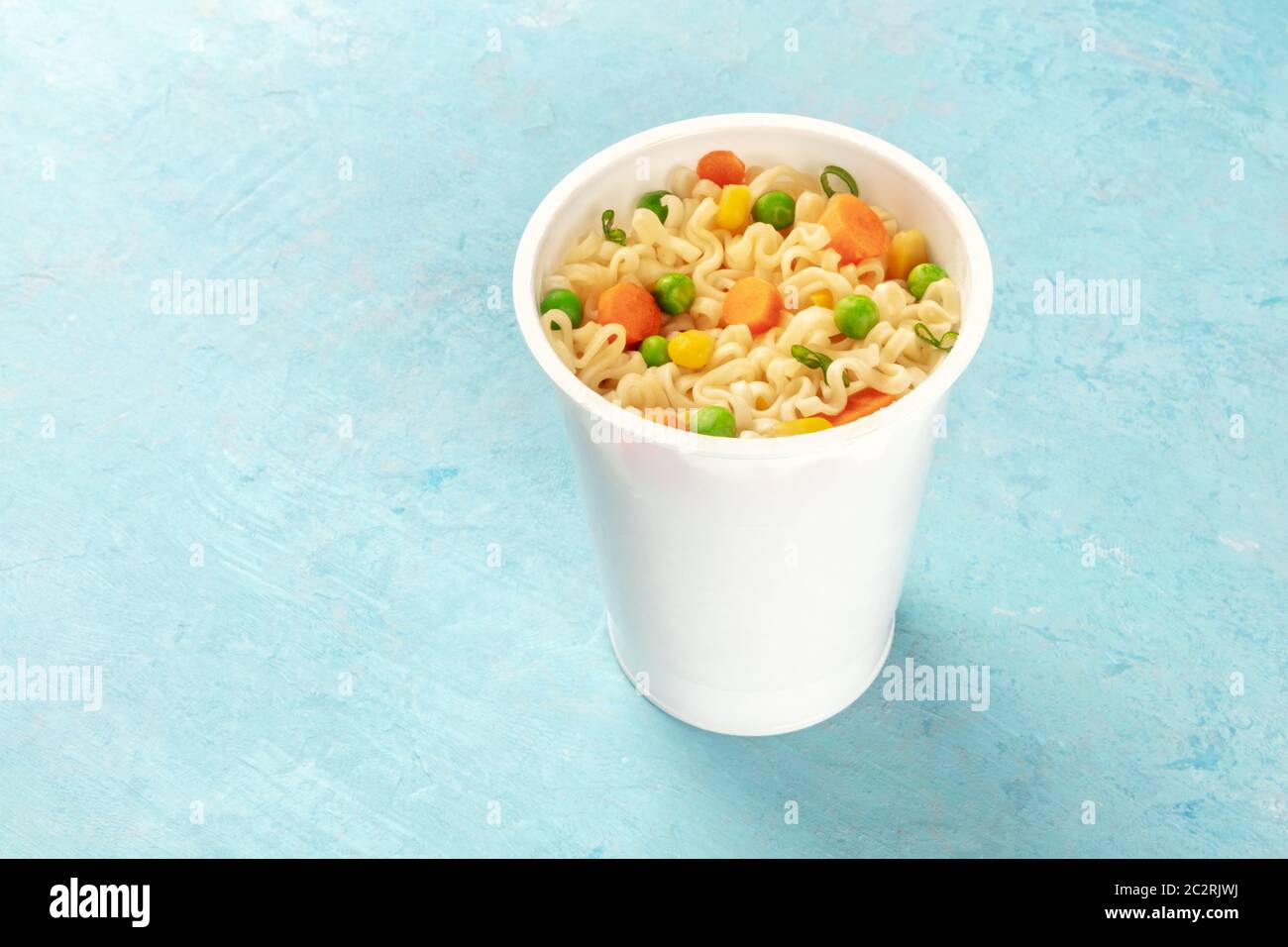 Ramen cup, instant soba noodles in a plastic cup with vegetables and a ...