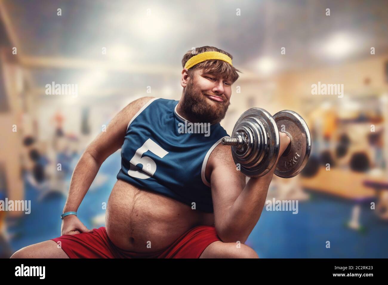 Fat man do exercises with a dumbbell in the gym Stock Photo - Alamy