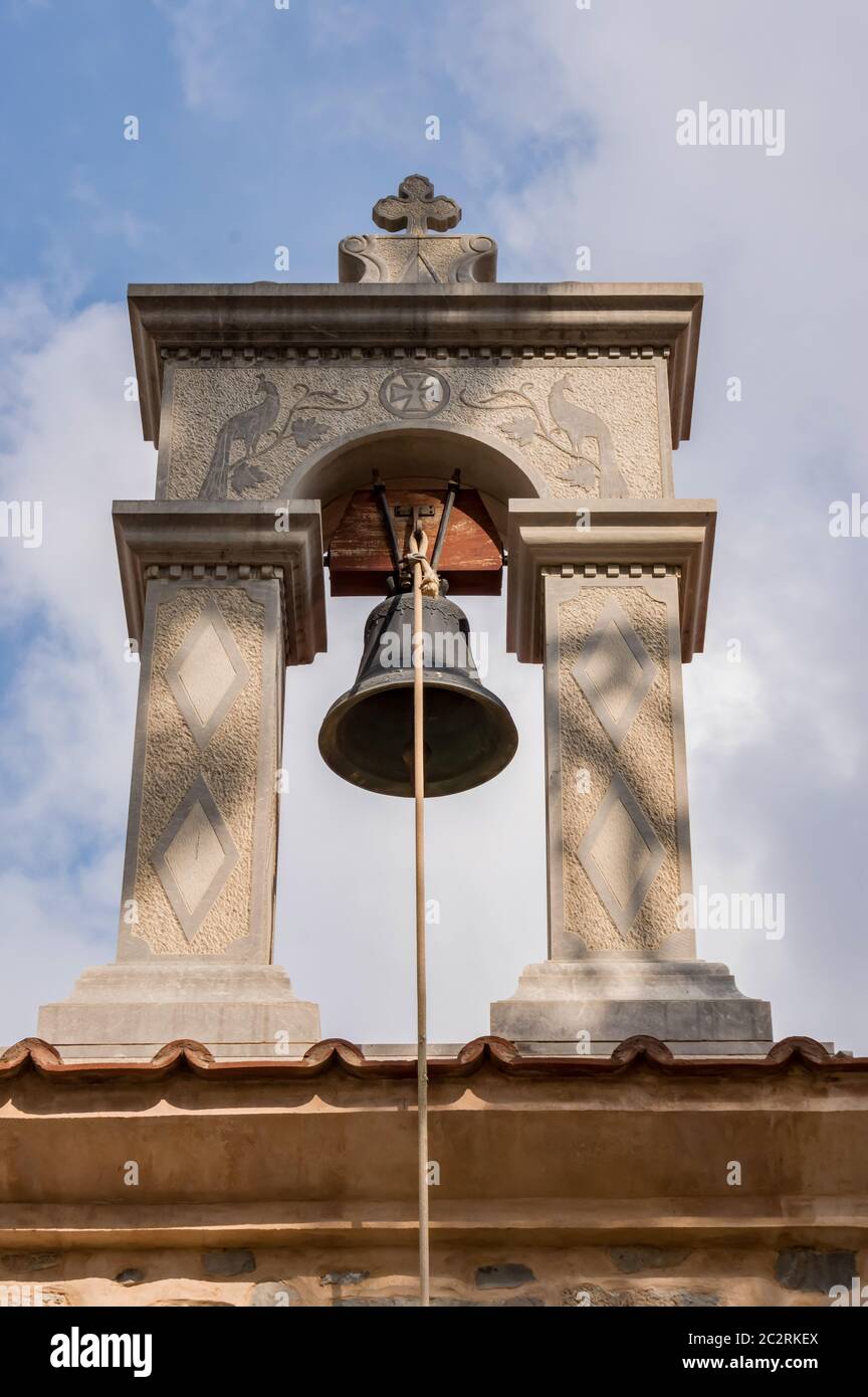 Bell hanging on a stone arch Stock Photo - Alamy