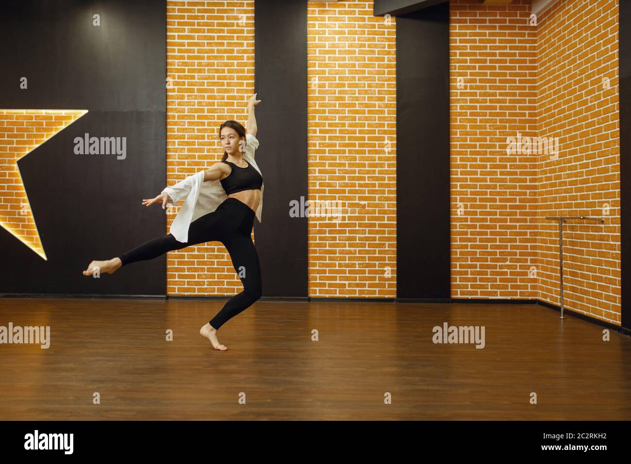 Contemporary dance performer, woman in studio, body flexibility. Dancer ...