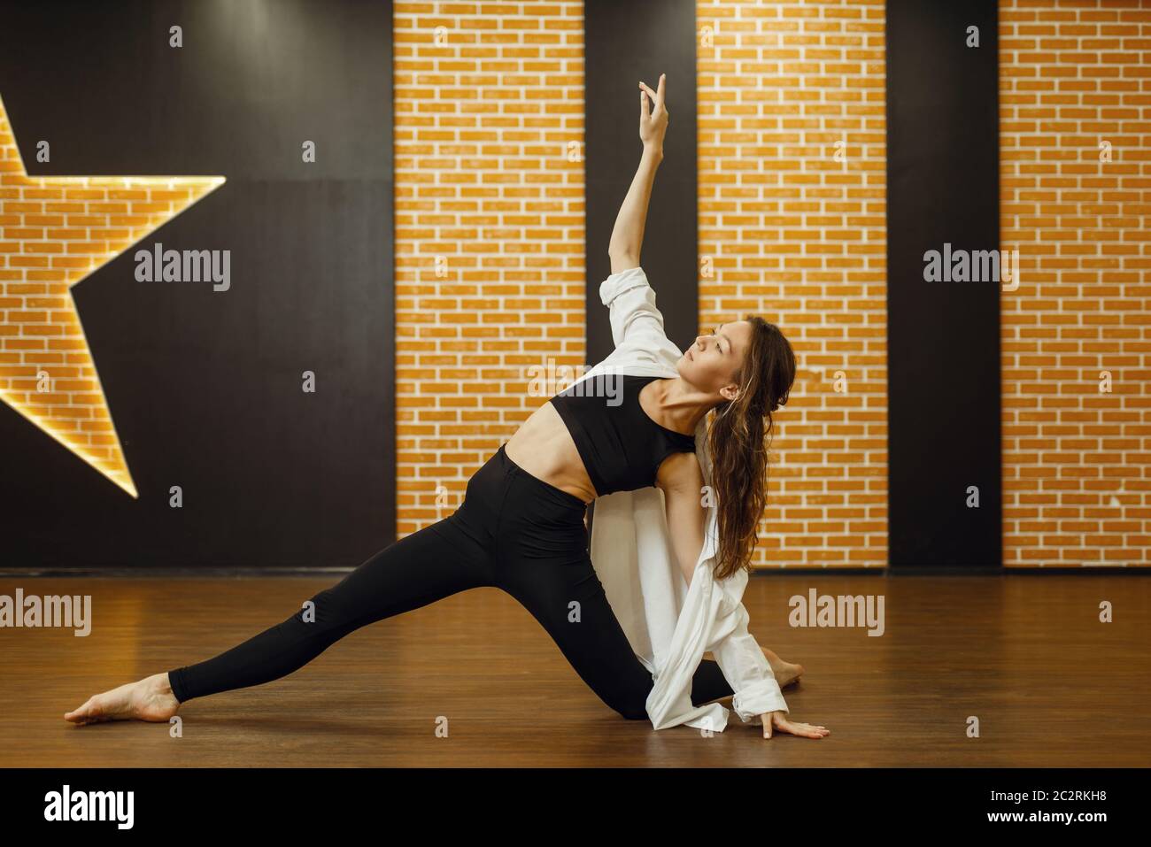 Contemporary dance performer, woman in studio, body flexibility. Dancer ...