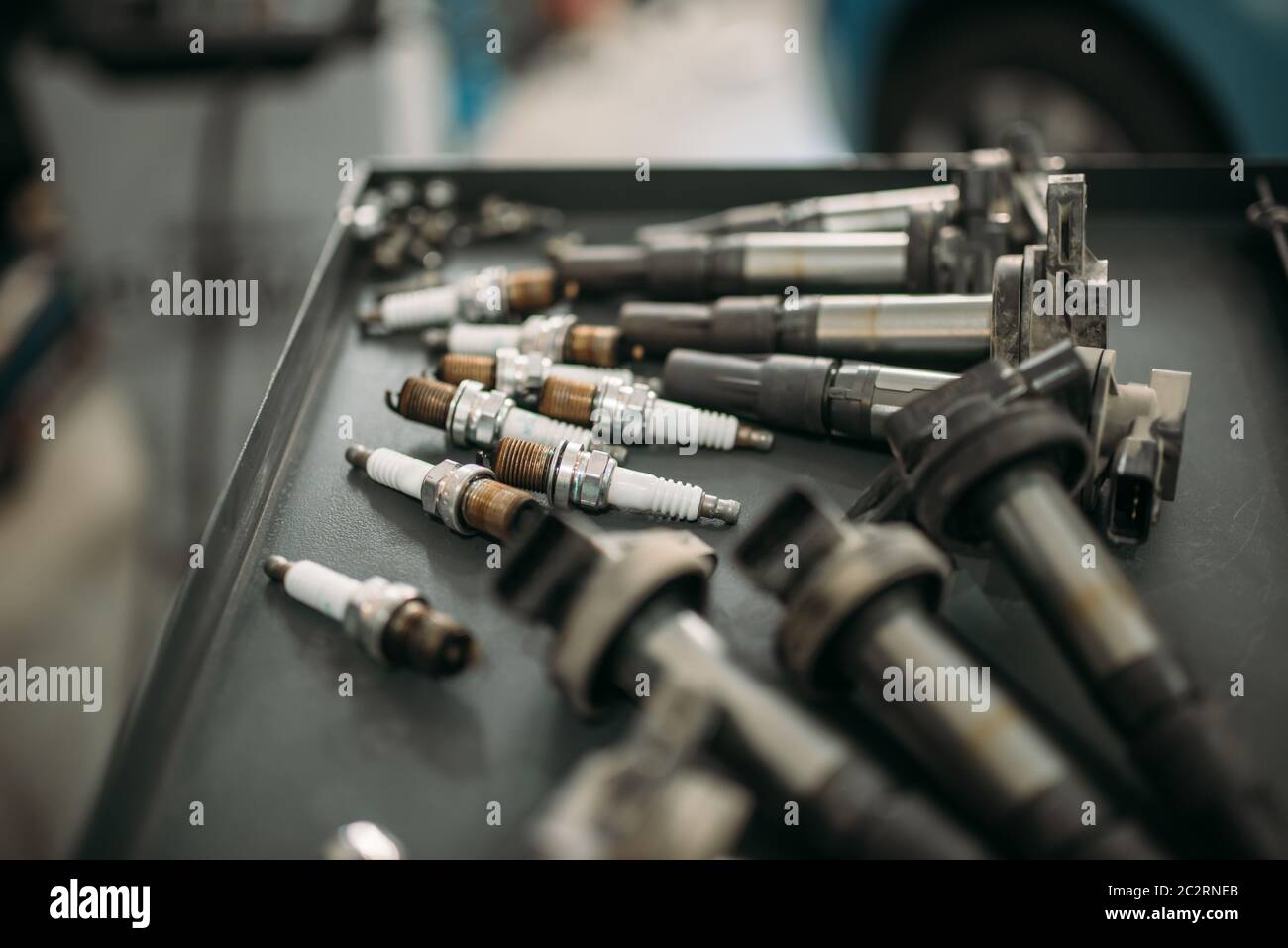 Car spark plugs and wires on the table closeup, nobody, motor ...