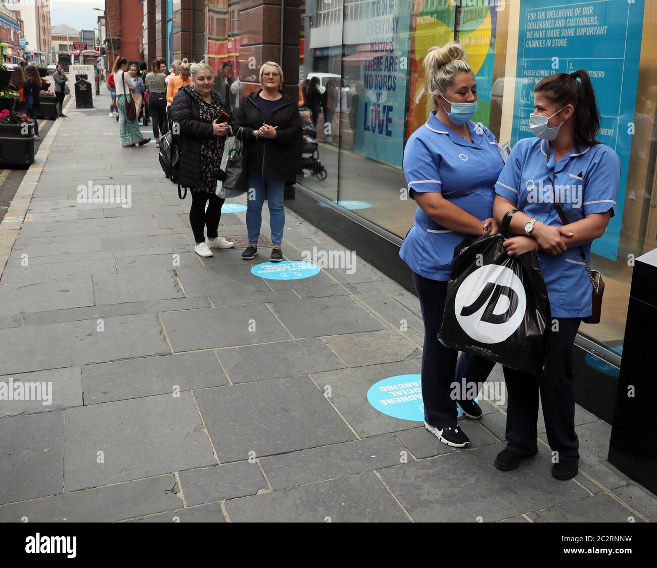 Care workers queue outside primark hi-res stock photography and images ...