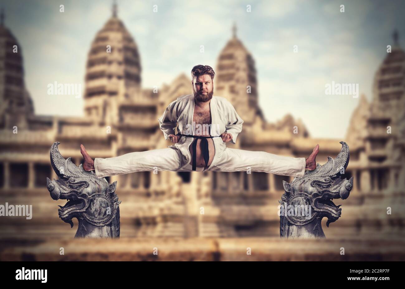 Fat karate fighter practicing against the temple Stock Photo - Alamy