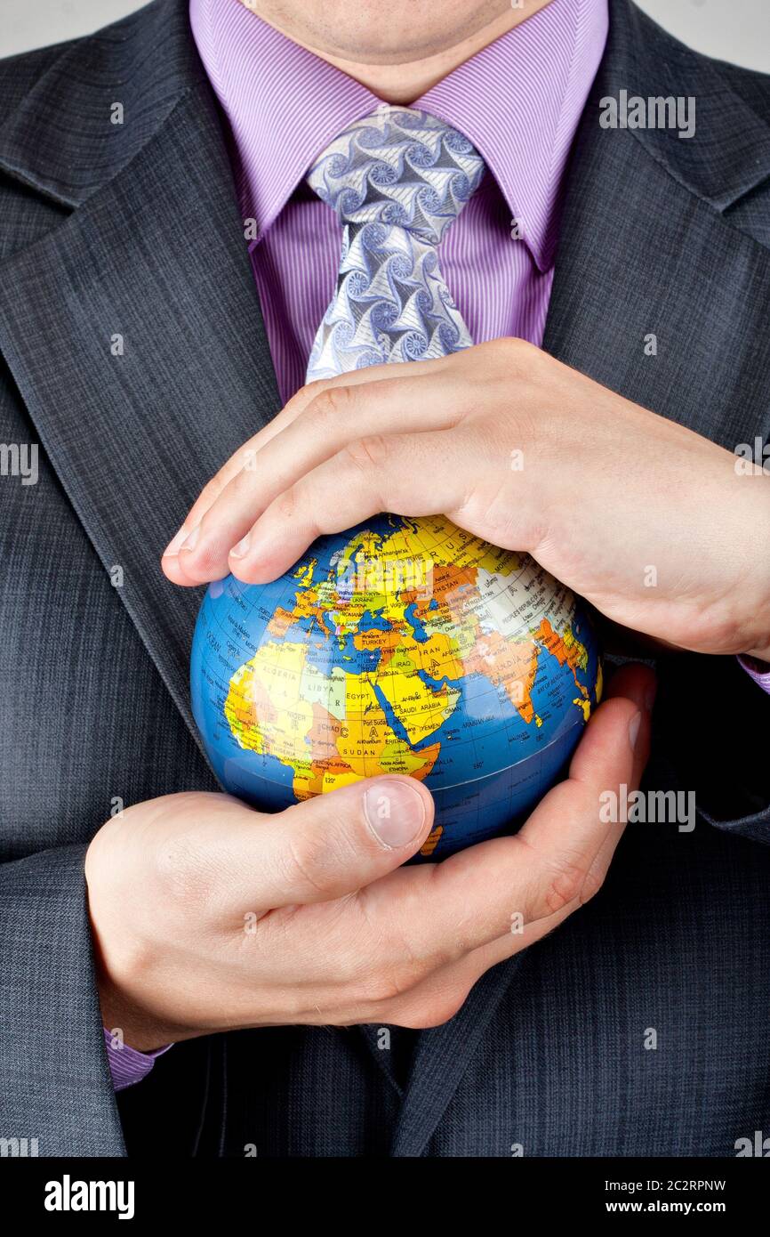 Close-up of a businessman carrying world globe Stock Photo - Alamy