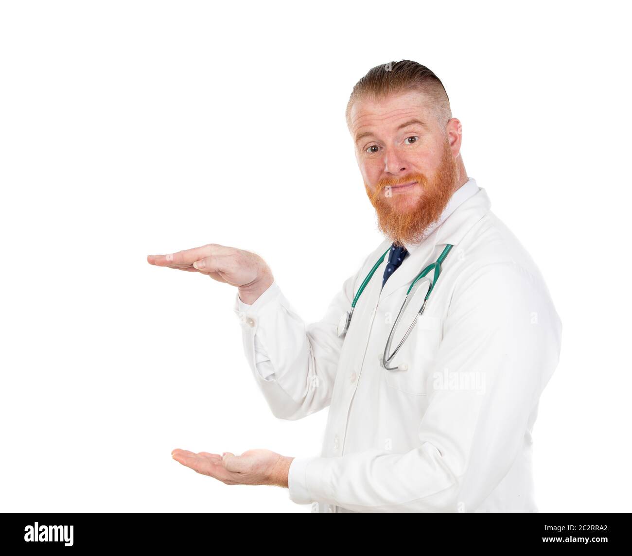 Redhead doctor wearing medical gown holding nothing on palm as copy ...