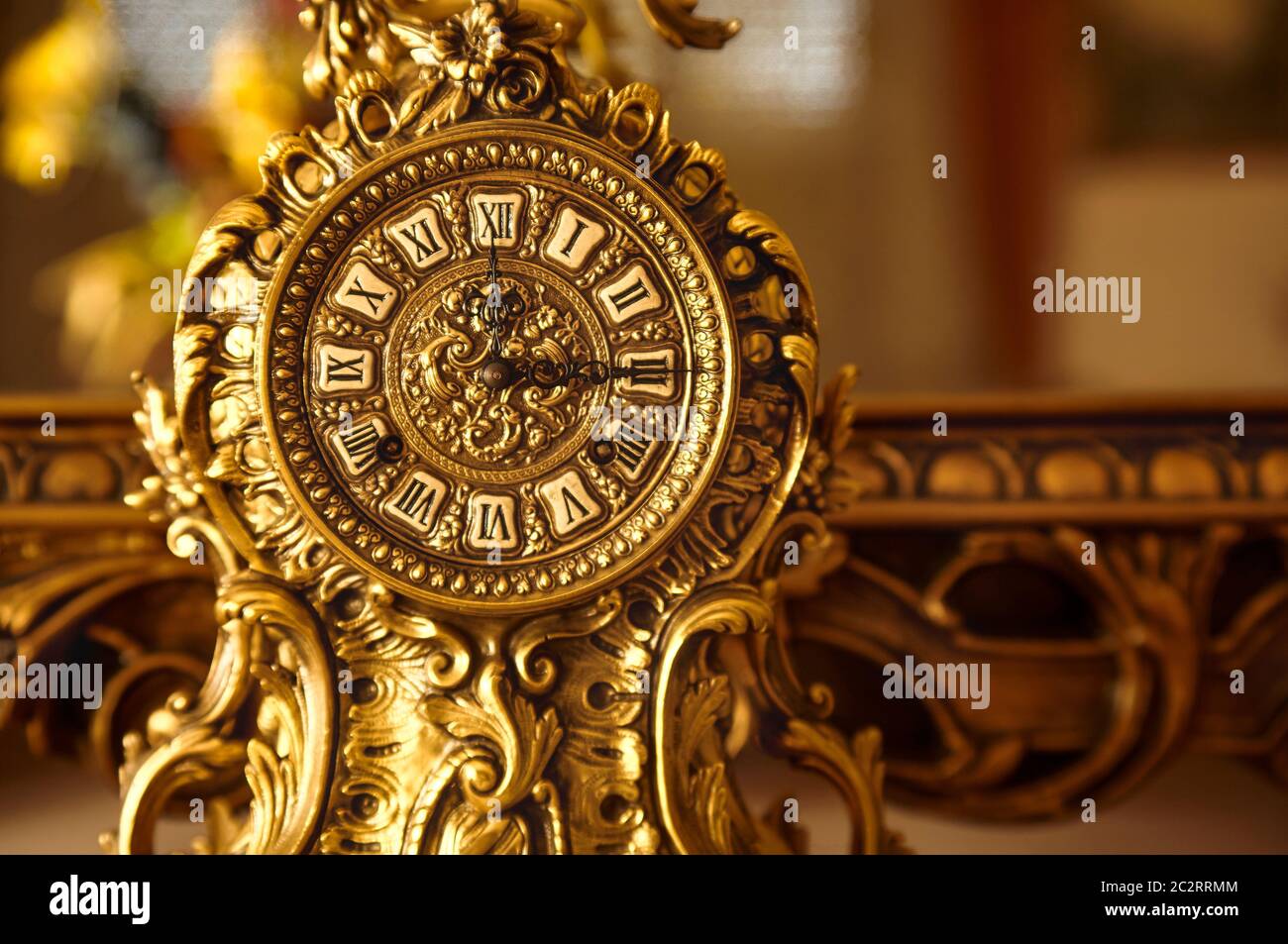 Detail of a beautiful vintage clock in the baroque style in brass Stock ...