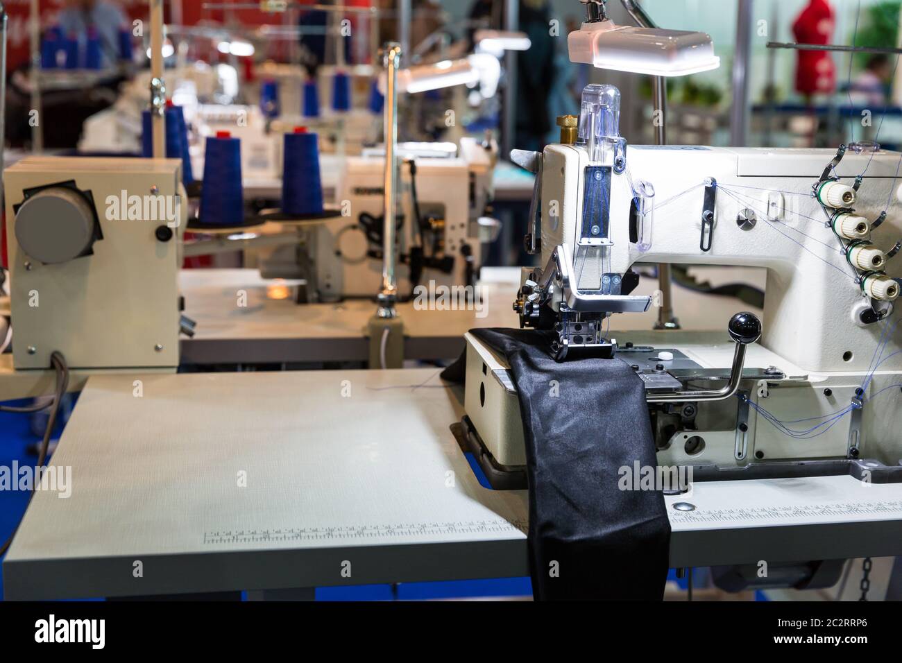 Sewing machine in cutting shop on leather cloth factory, nobody. Fabric ...