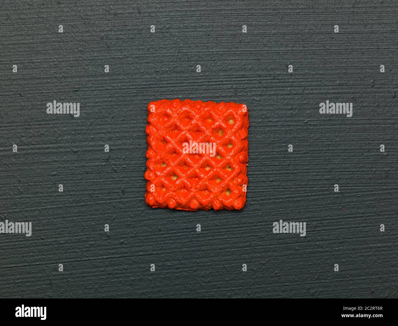 red christmas cookies on black wooden background from above Stock Photo ...