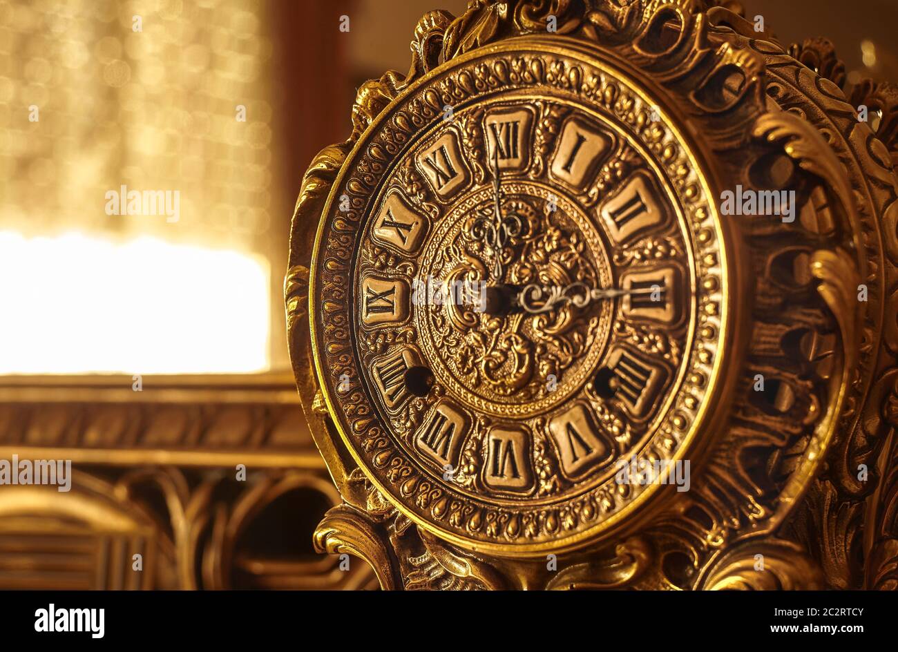 Detail of a beautiful vintage clock in the baroque style in brass Stock ...