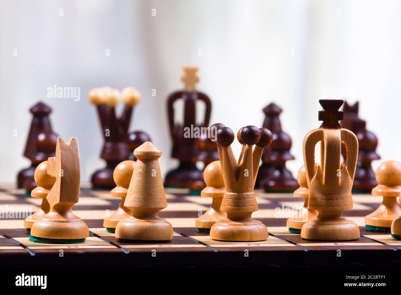 Chess pieces game board background hi-res stock photography and images ...