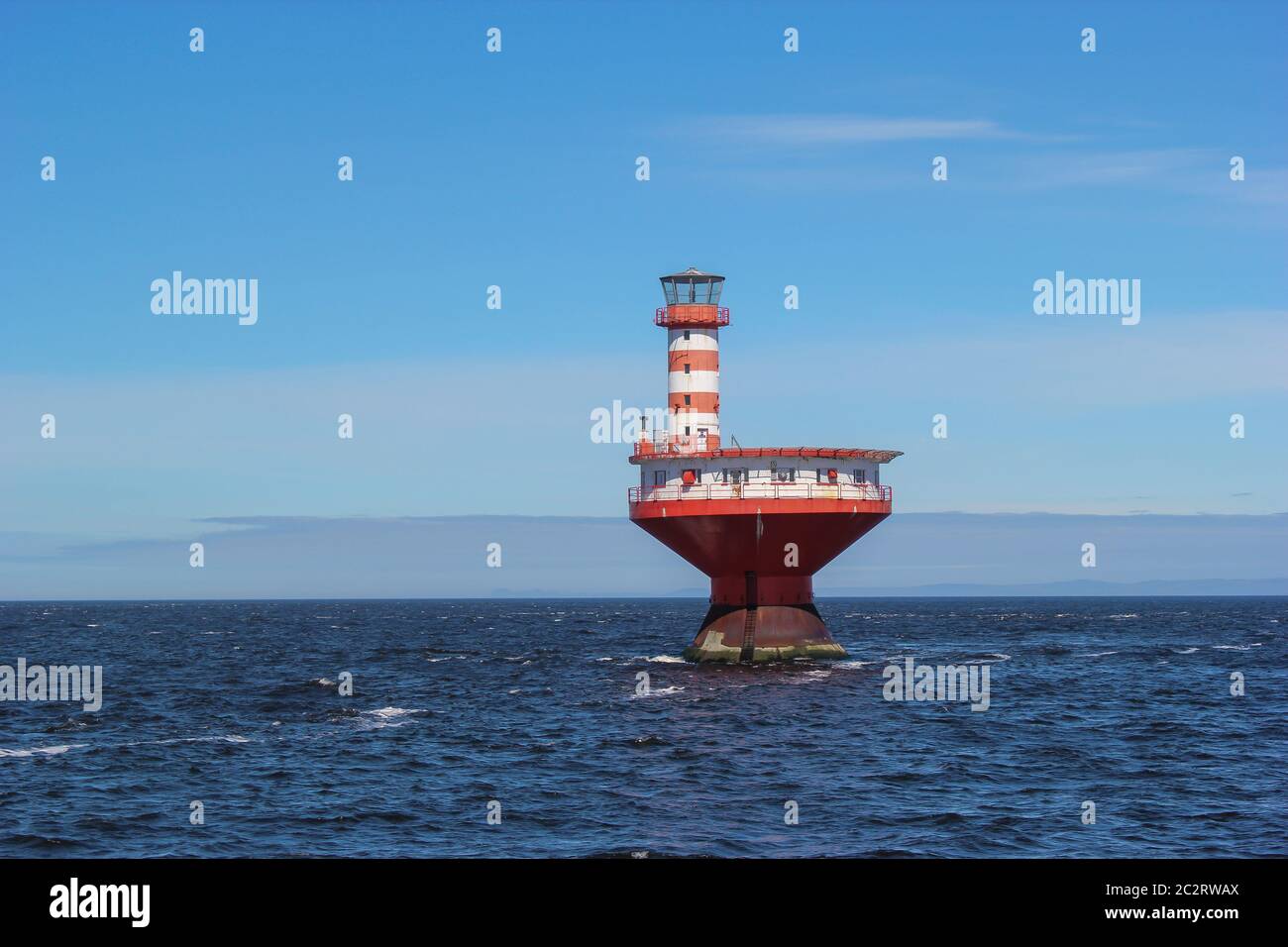 The red lighthouse in river Saint Laurent near little city of Tadoussac ...