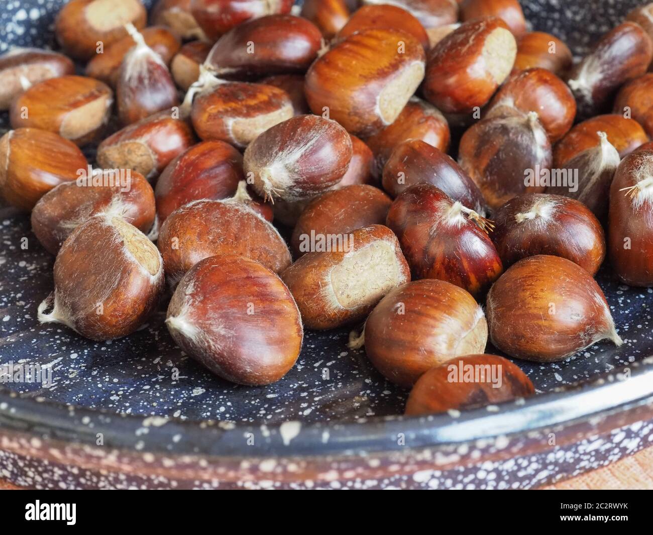 chestnuts food in a pan useful as a background Stock Photo - Alamy