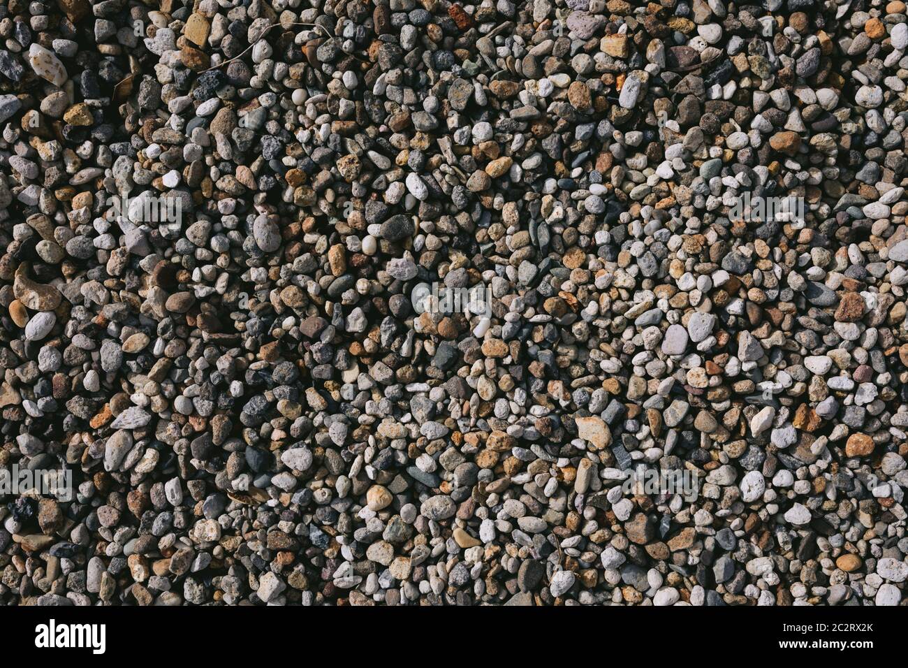 colourful Pebble shingle stones on path Stock Photo - Alamy