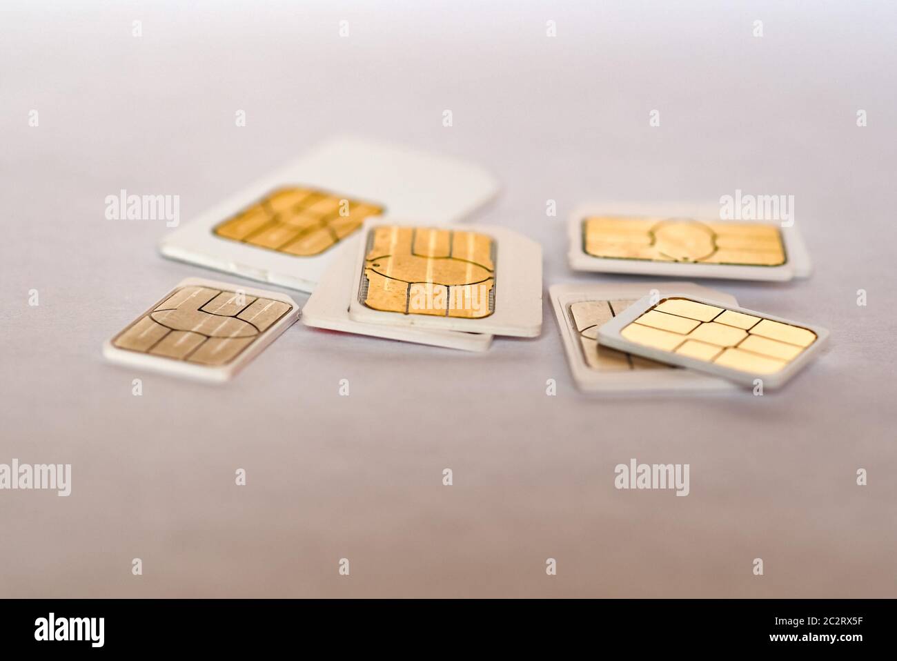 Many mini micro and nano sim cards for mobile telephone Stock Photo - Alamy