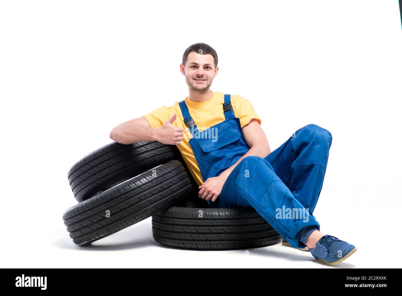 Man sitting in car tyre hi-res stock photography and images - Alamy