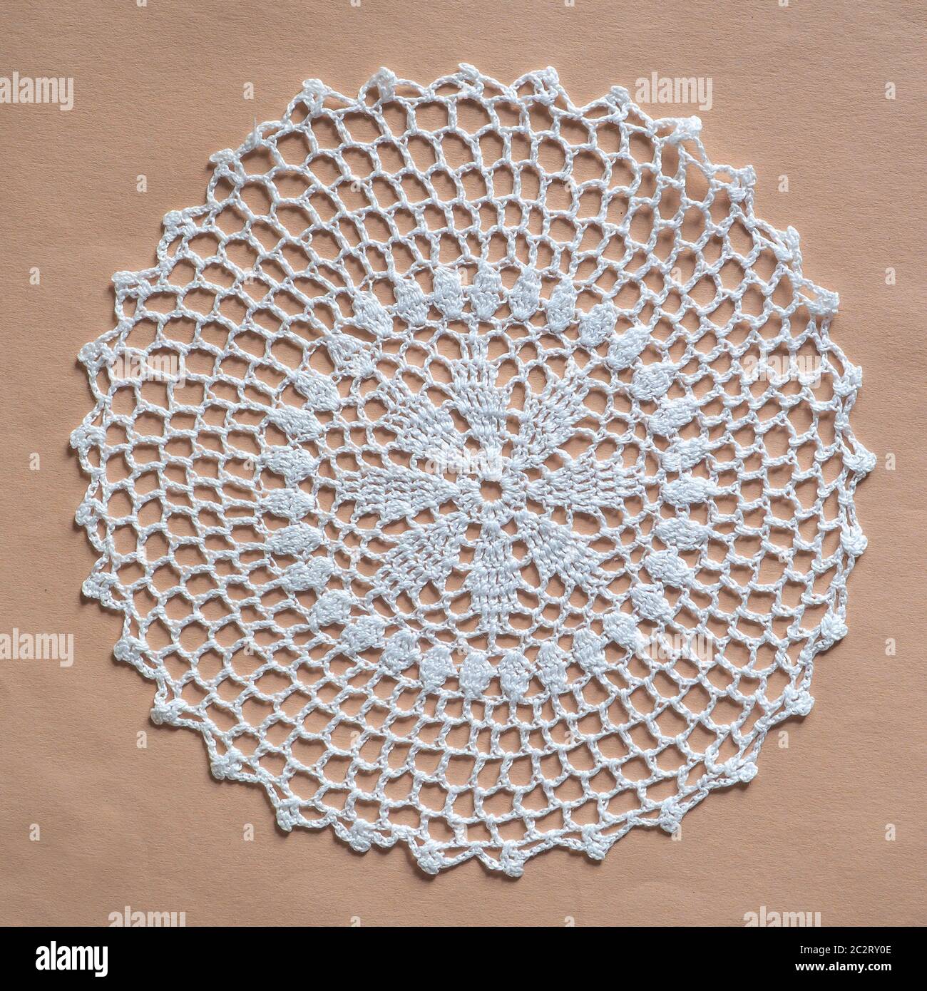 white decorated ornamental doily in white fabric Stock Photo - Alamy