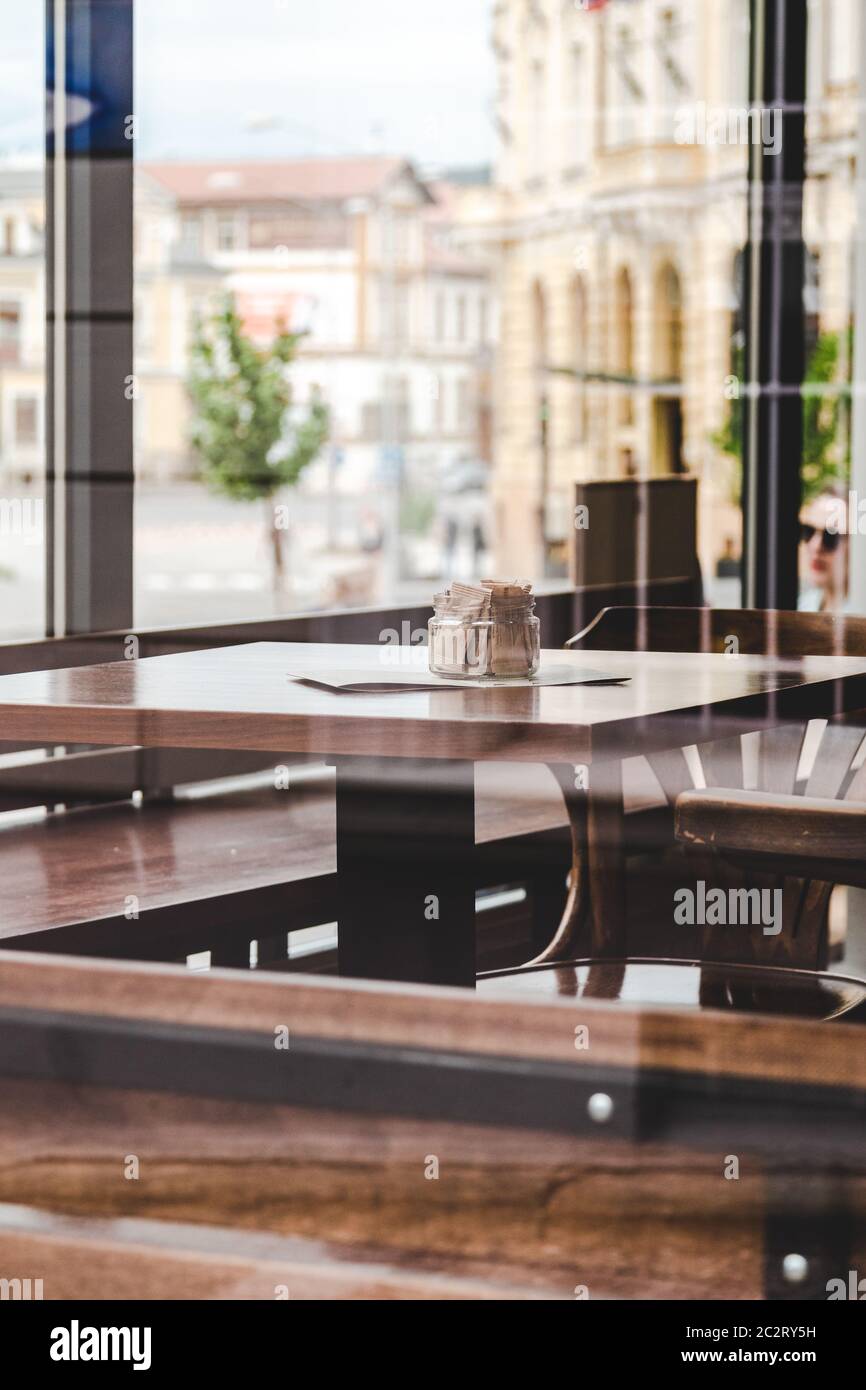 Glass full of sugar packets in expensive luxury modern coffee shop at ...
