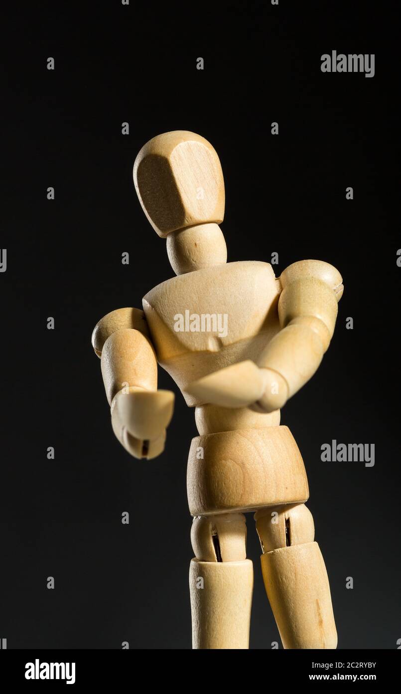 Human wood manikin showing something closeup Stock Photo - Alamy