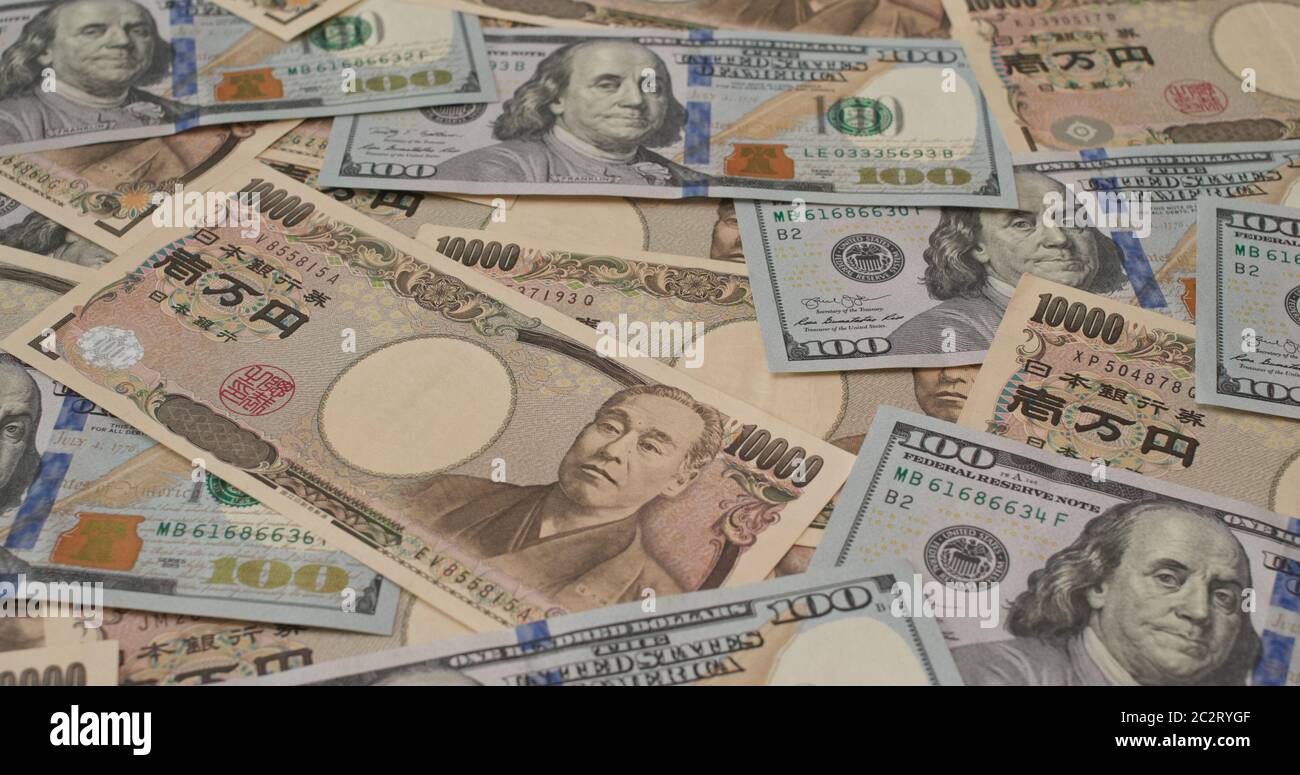 Stack of Japanese yen and USD Stock Photo - Alamy